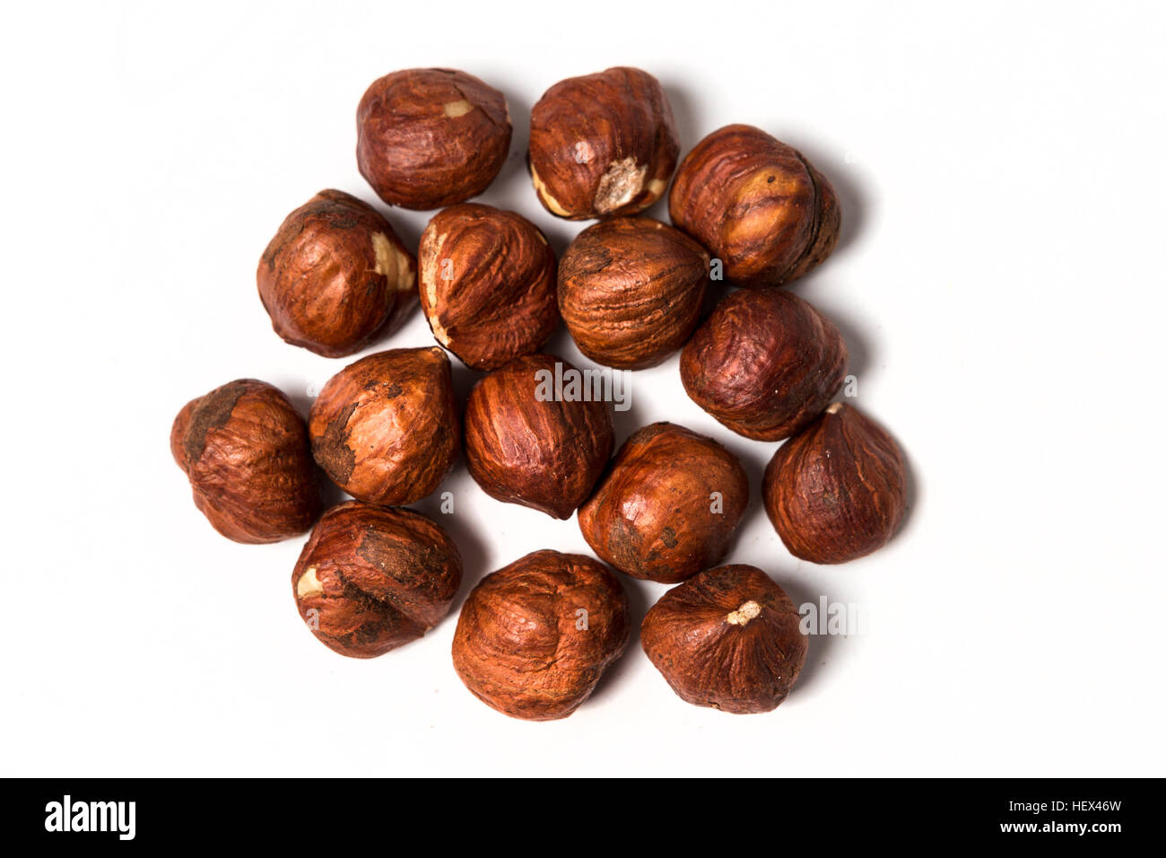 Pile of unshelled hazelnuts isolated on white background Stock Photo ...