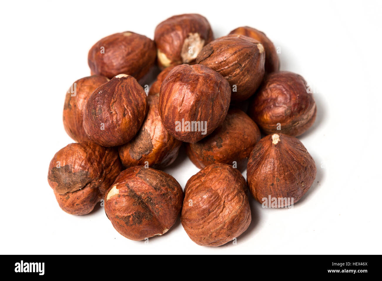Pile of unshelled hazelnuts isolated on white background Stock Photo ...
