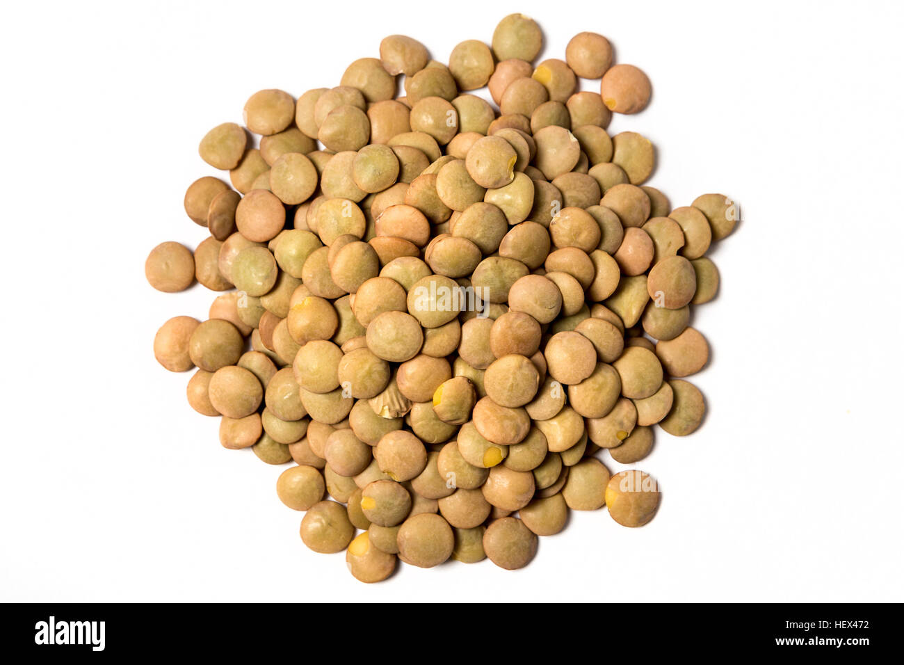 Pile of dehydrated lentils isolated on white background Stock Photo - Alamy