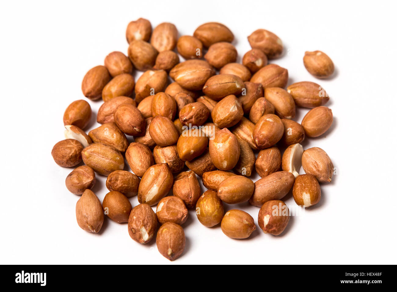 Raw spanish peanuts isolated on white background Stock Photo - Alamy