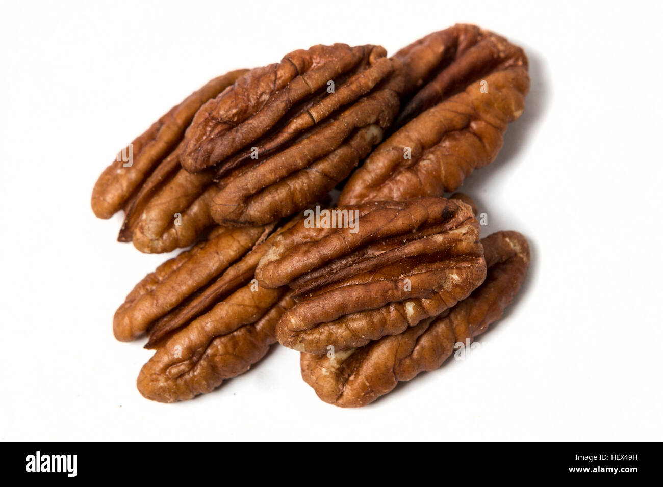 Stack of Pecans isolated on white background Stock Photo - Alamy