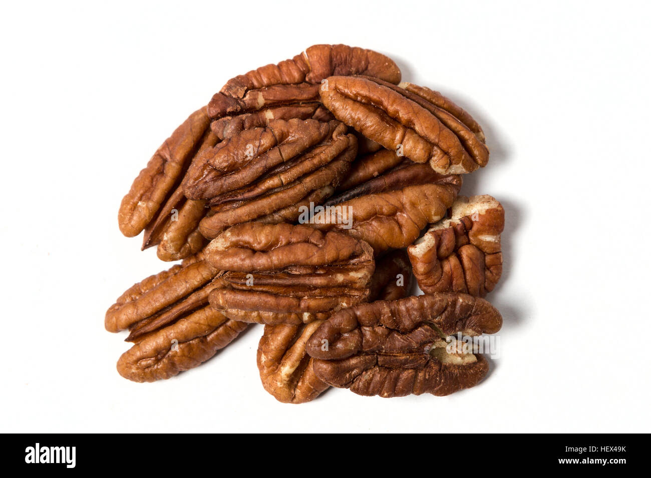 Stack of Pecans isolated on white background Stock Photo - Alamy