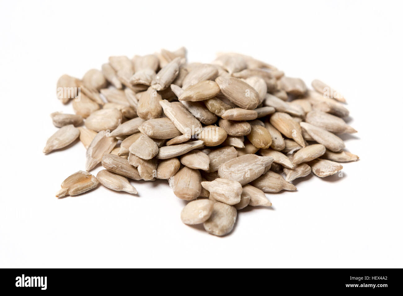 Unshelled sunflower seeds isolated on white background Stock Photo - Alamy