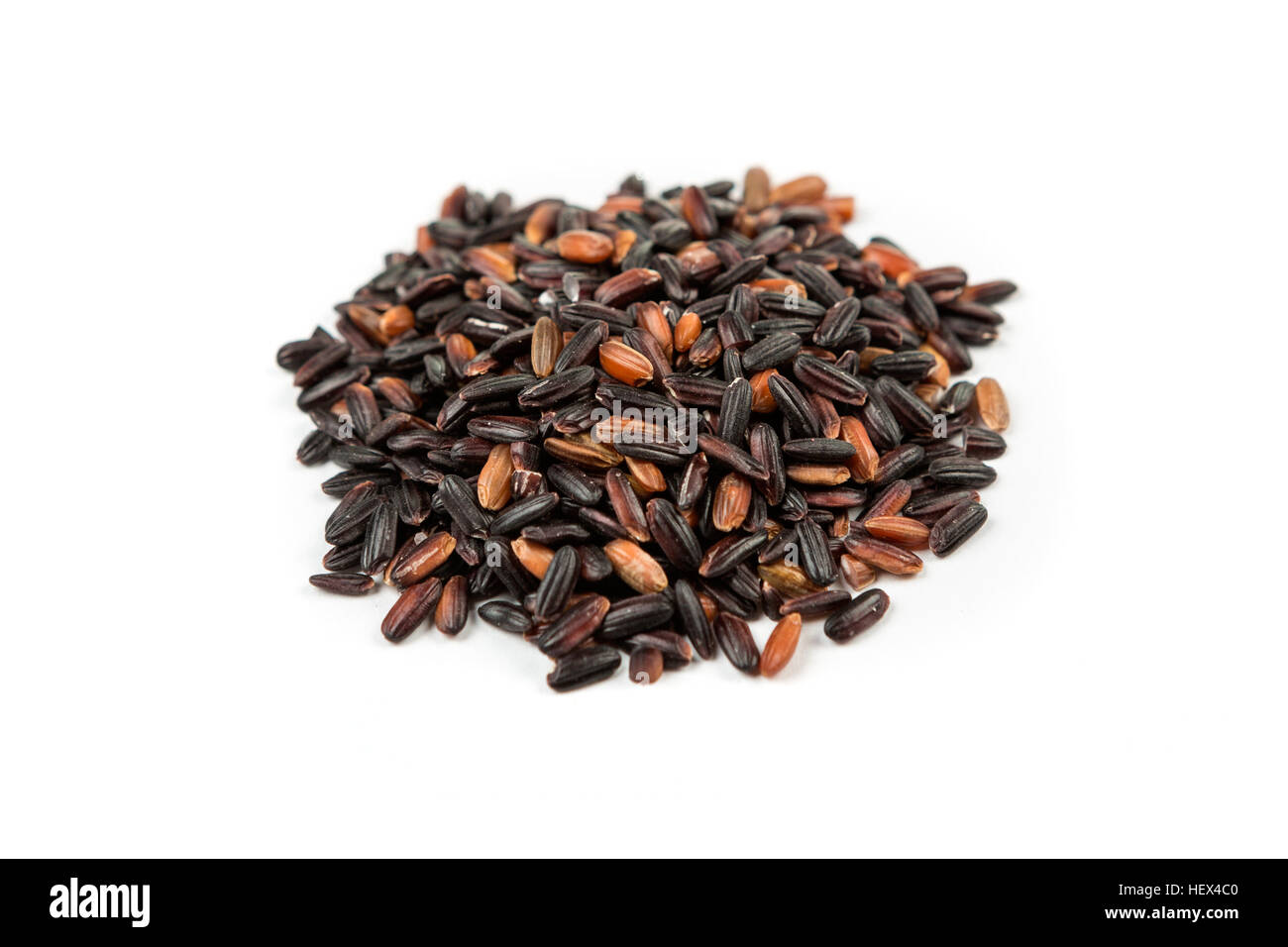 Japonica black rice isolated on white background Stock Photo - Alamy