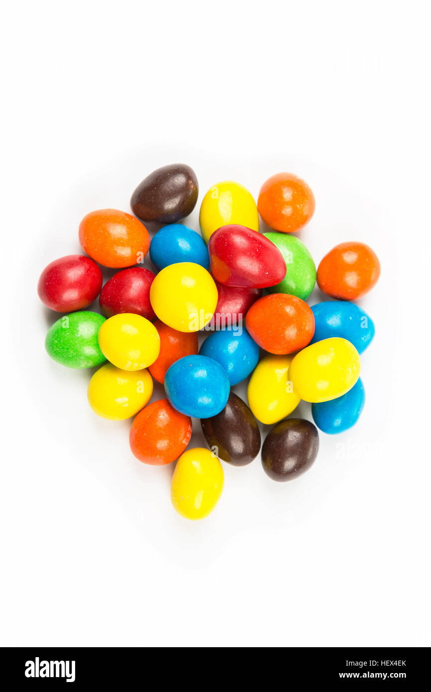 Chocolate covered peanuts with a candy shell isolated on white ...