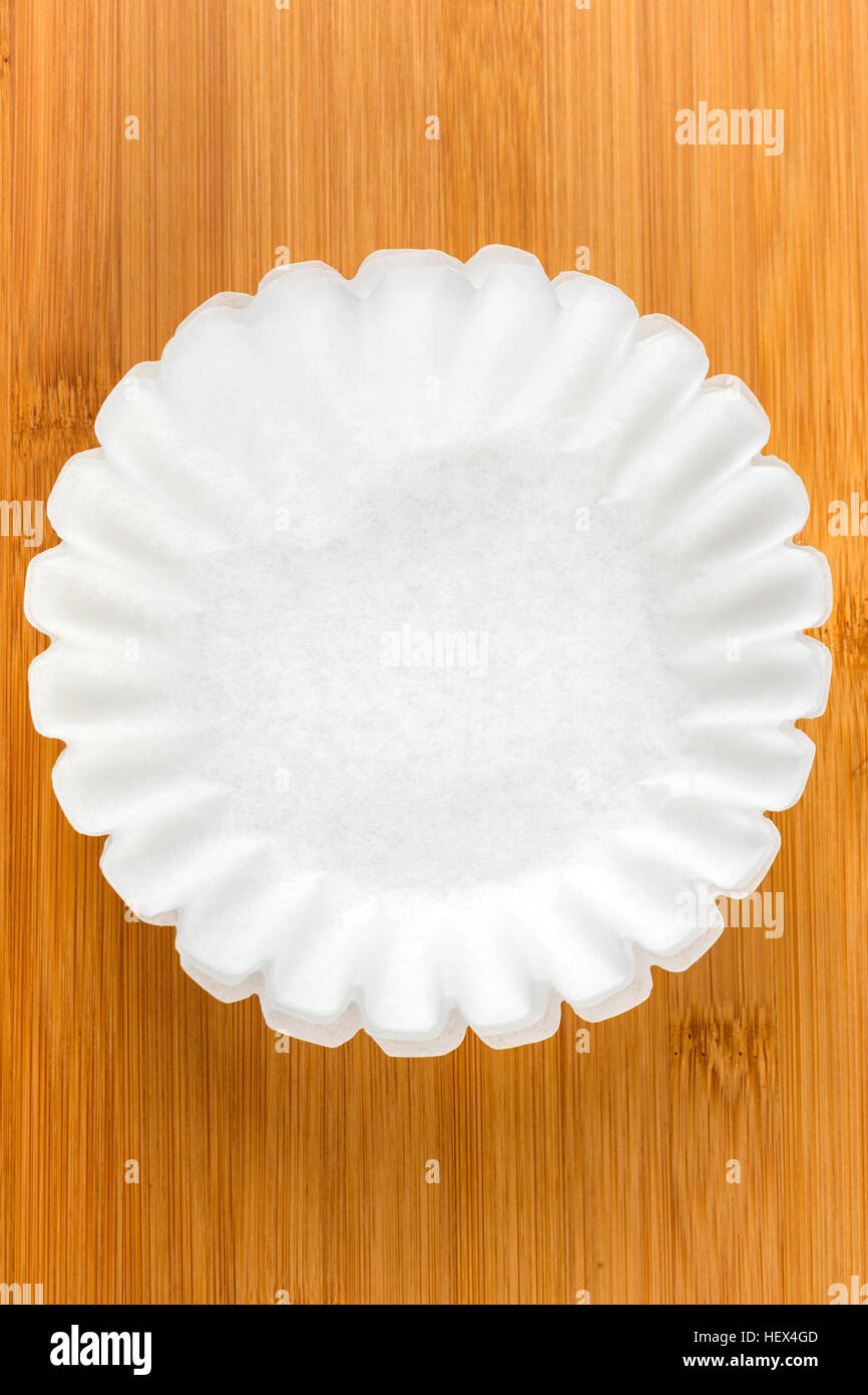Stack of coffee filters isolated on wood background Stock Photo - Alamy
