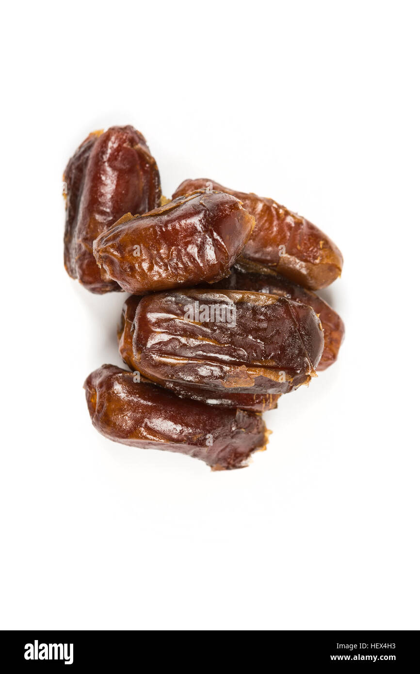 Whole pitted dates isolated on white background Stock Photo - Alamy