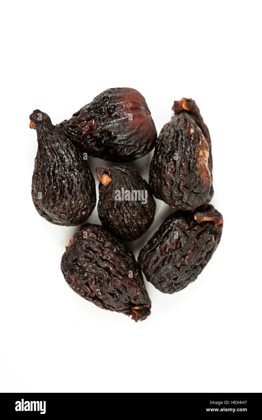 Black mission figs isolated on white background Stock Photo - Alamy