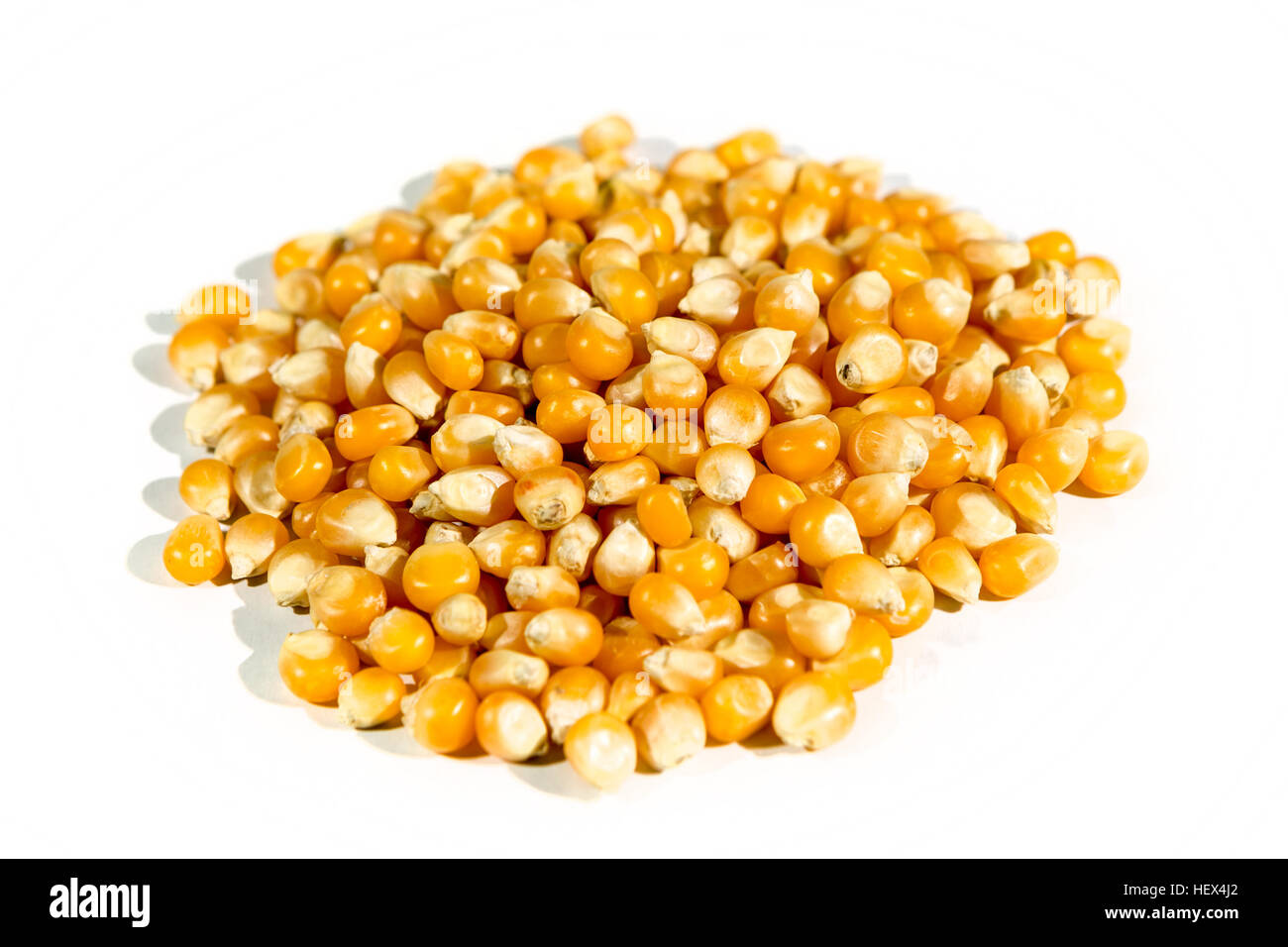 Organic yellow popcorn grains isolated on white Stock Photo - Alamy