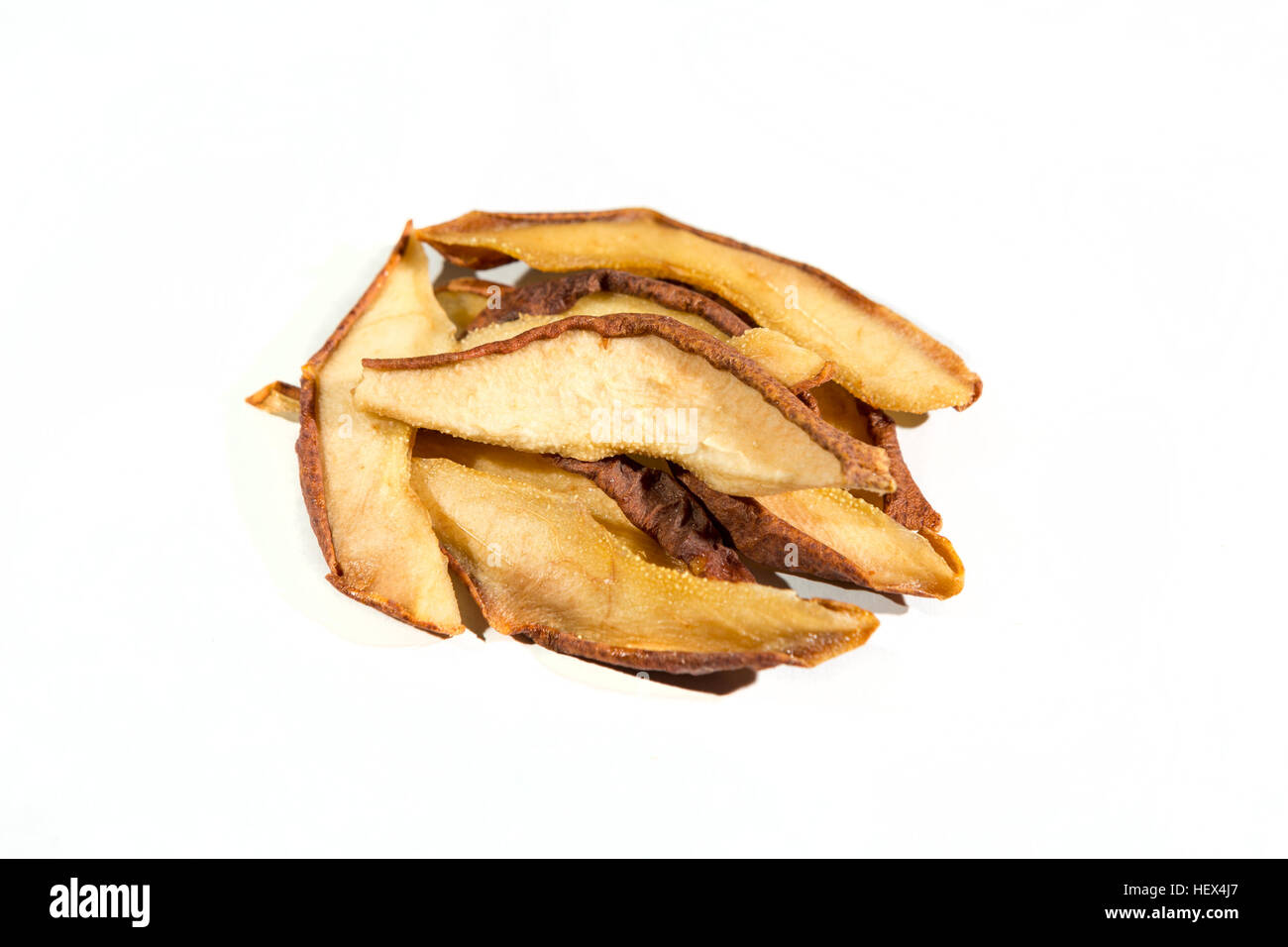 Hand picked home dried pear slices isolated on white Stock Photo - Alamy