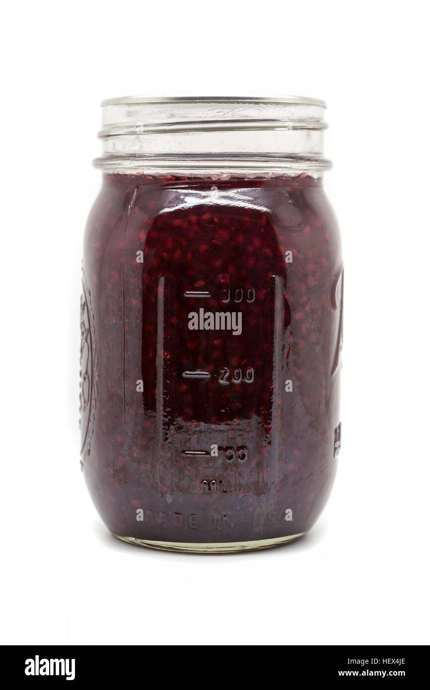 Jar of home canned raspberry jelly isolated on white Stock Photo - Alamy