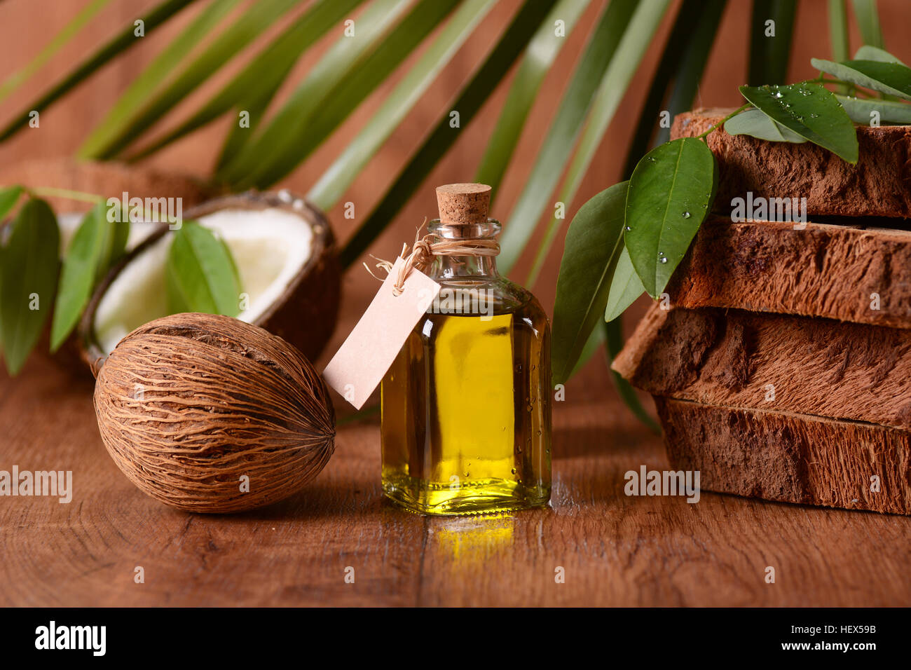 coconut oil in the bottle with fruits around Stock Photo - Alamy