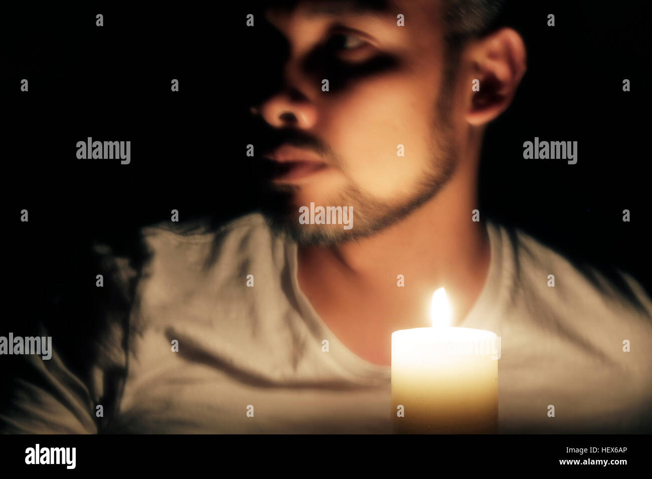 Slow shutter speed of self with candle in the dark Stock Photo - Alamy