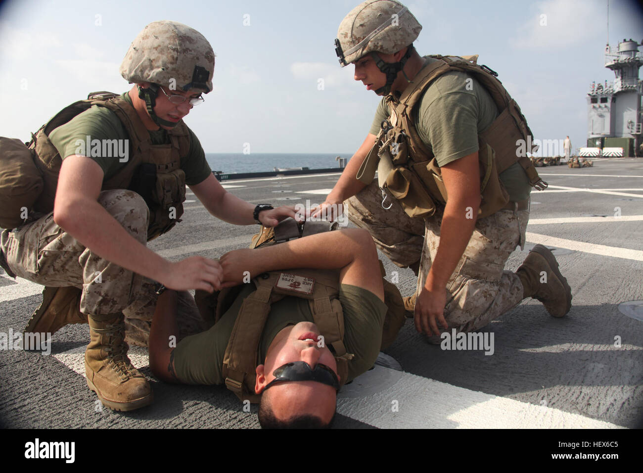 Lance Corporals Kenith Reed and Aaron Patterson assess the injuries of ...