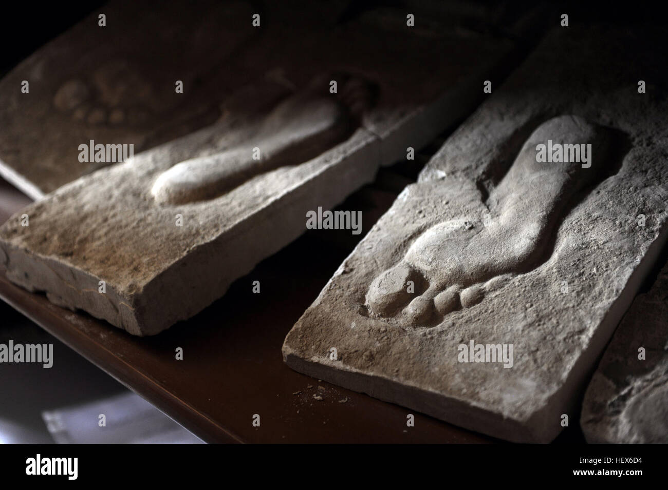 Footprint molds lay on a shelf in an evidence room during a ...