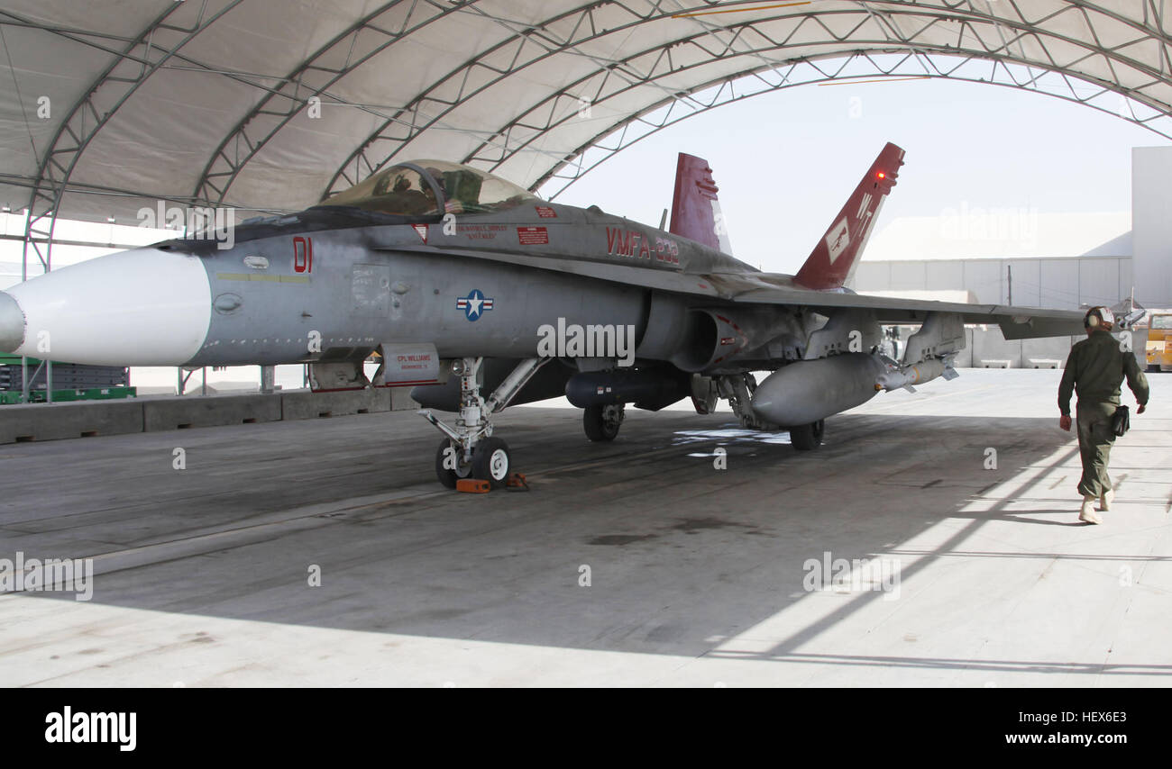 KANDAHAR AIR FIELD, Afghanistan – Cpl. Kevin Reuter, a plane captain ...