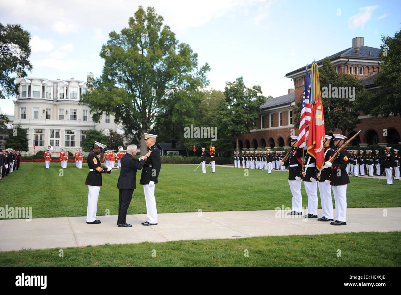 Secretary of Defense Robert M. Gates, center, presents a medal to ...