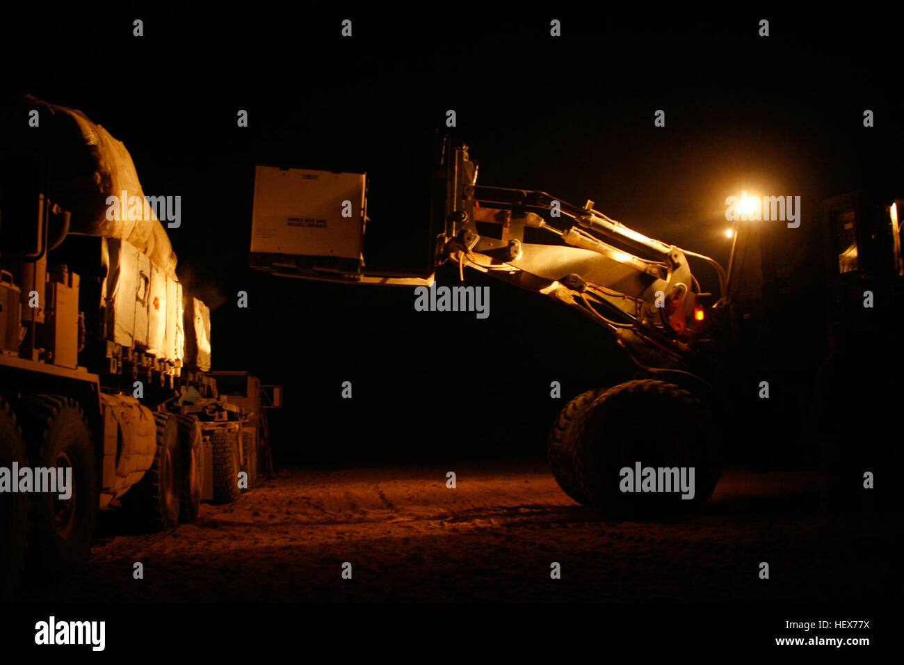 A Marine drives a Tractor Rubber tire Articulated steering Multi ...