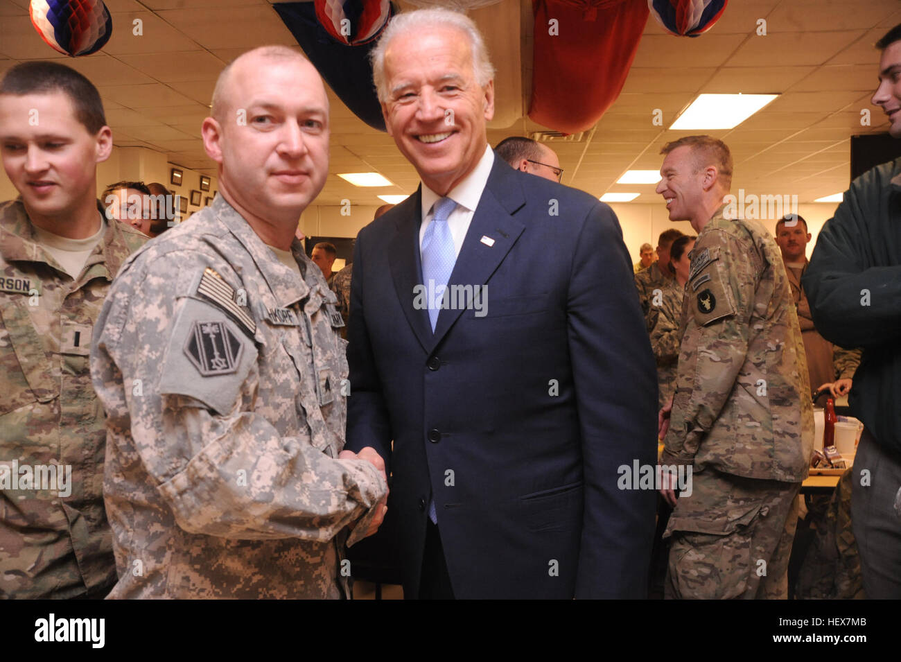 Sgt Arther Rehkopt, 46th Military Police Command, shakes hands with ...