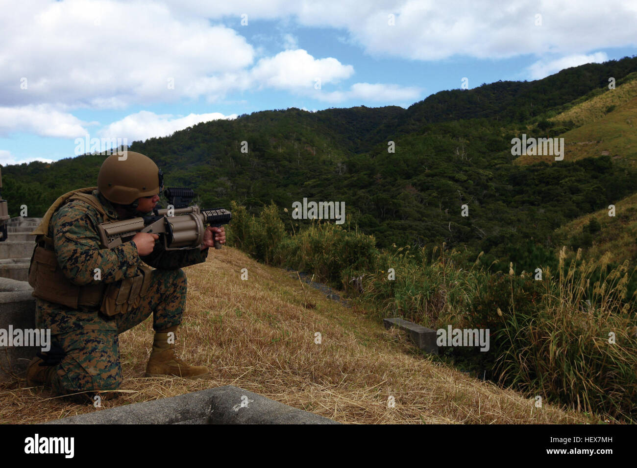 A Marine fires an M32A1 multi-shot grenade launcher during live-fire ...