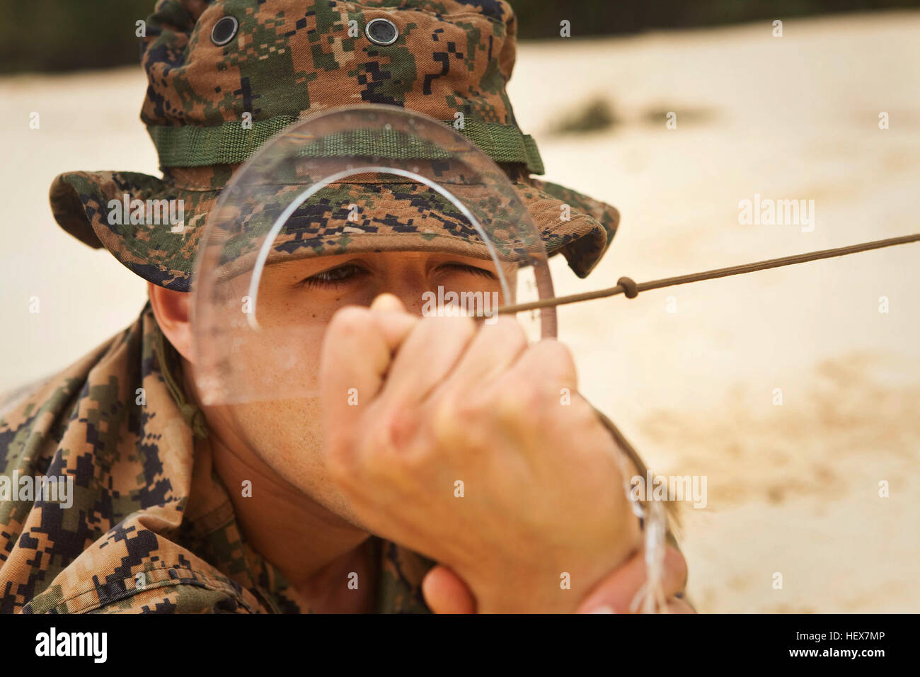 A Force Reconnaissance Marine conducts hydrographic reconnaissance at ...