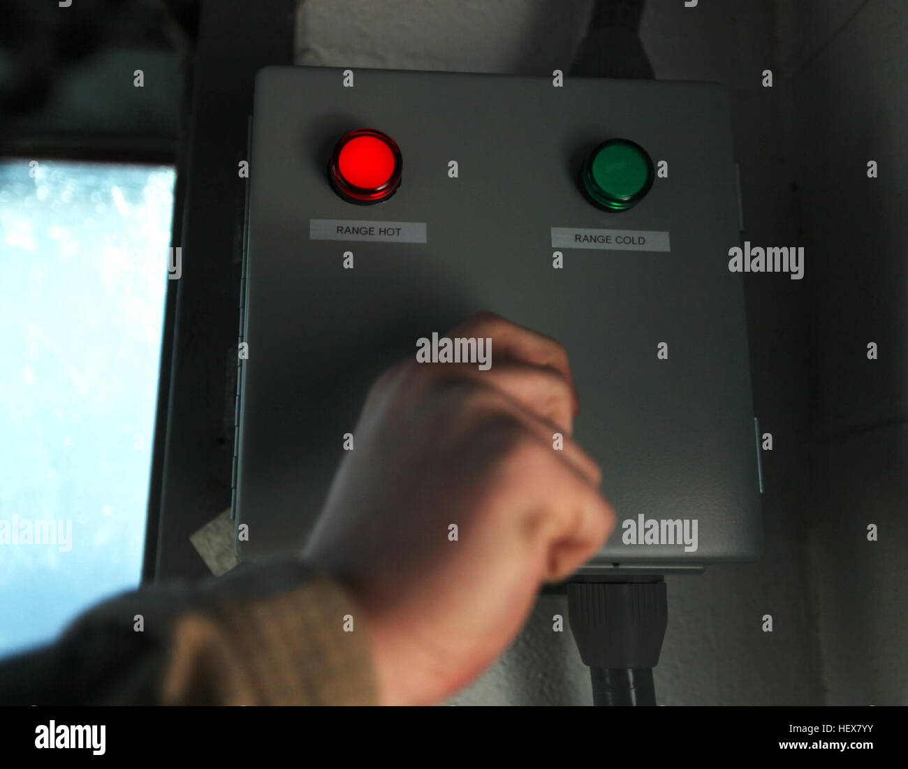 A pit non-commissioned officer changes a switchboard from "Range Cold ...
