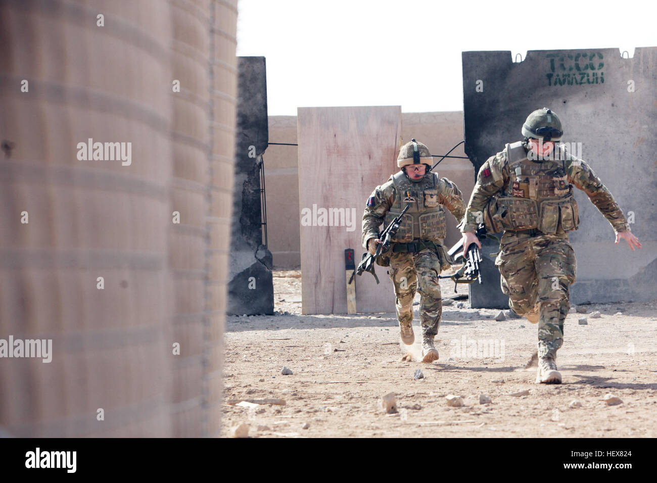 British Army engineers run back to cover after placing an explosive ...