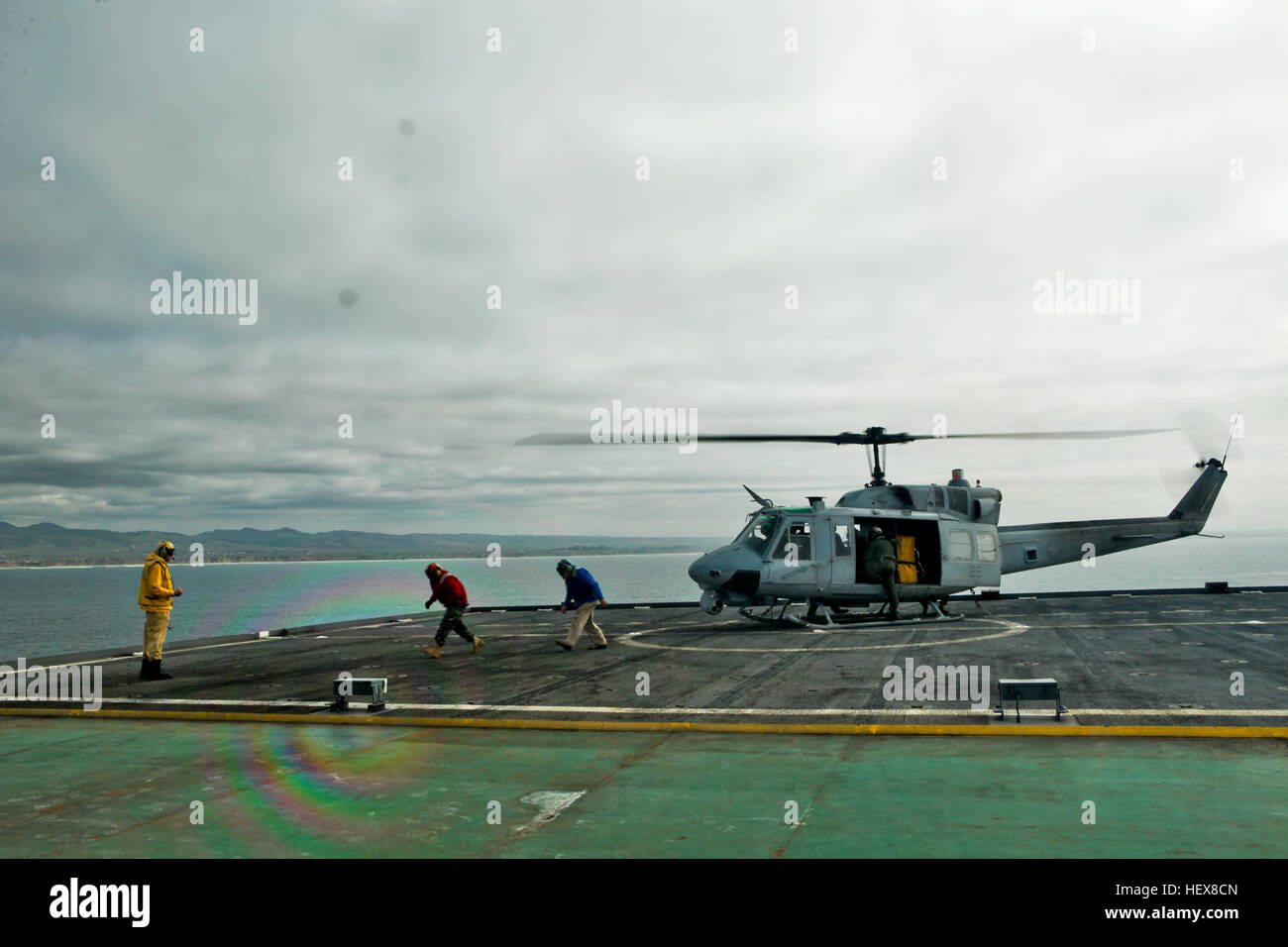 A UH-1N Huey lands on the deck of USNS Sgt. William Button near Camp ...