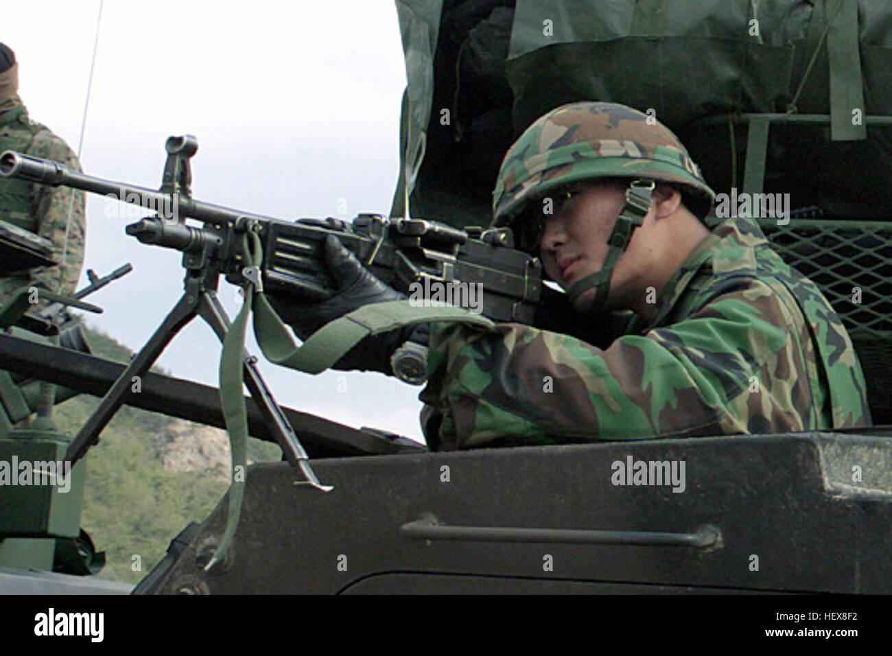 US Marine Corps (USMC) Lance Corporal (LCPL) Anthony Bittle (background ...