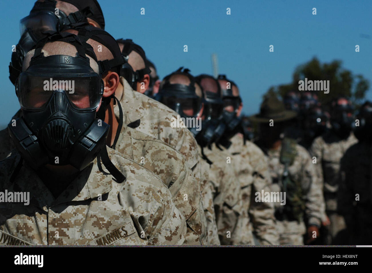U.S. Marine Corps recruits wear M50 gas masks before entering a ...