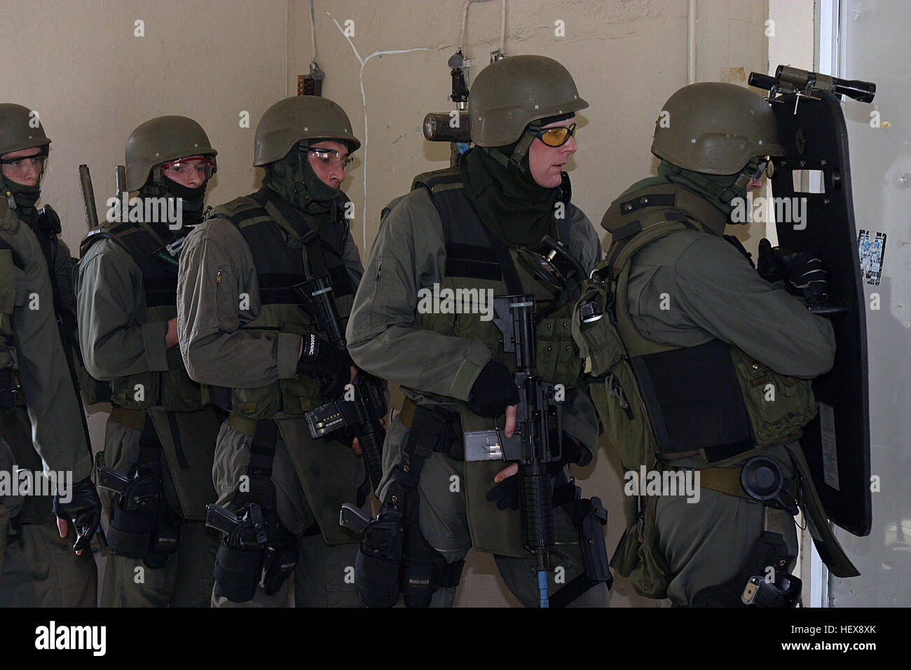 A US Marine Corps (USMC) Special Reaction Team (SRT) prepares to charge ...