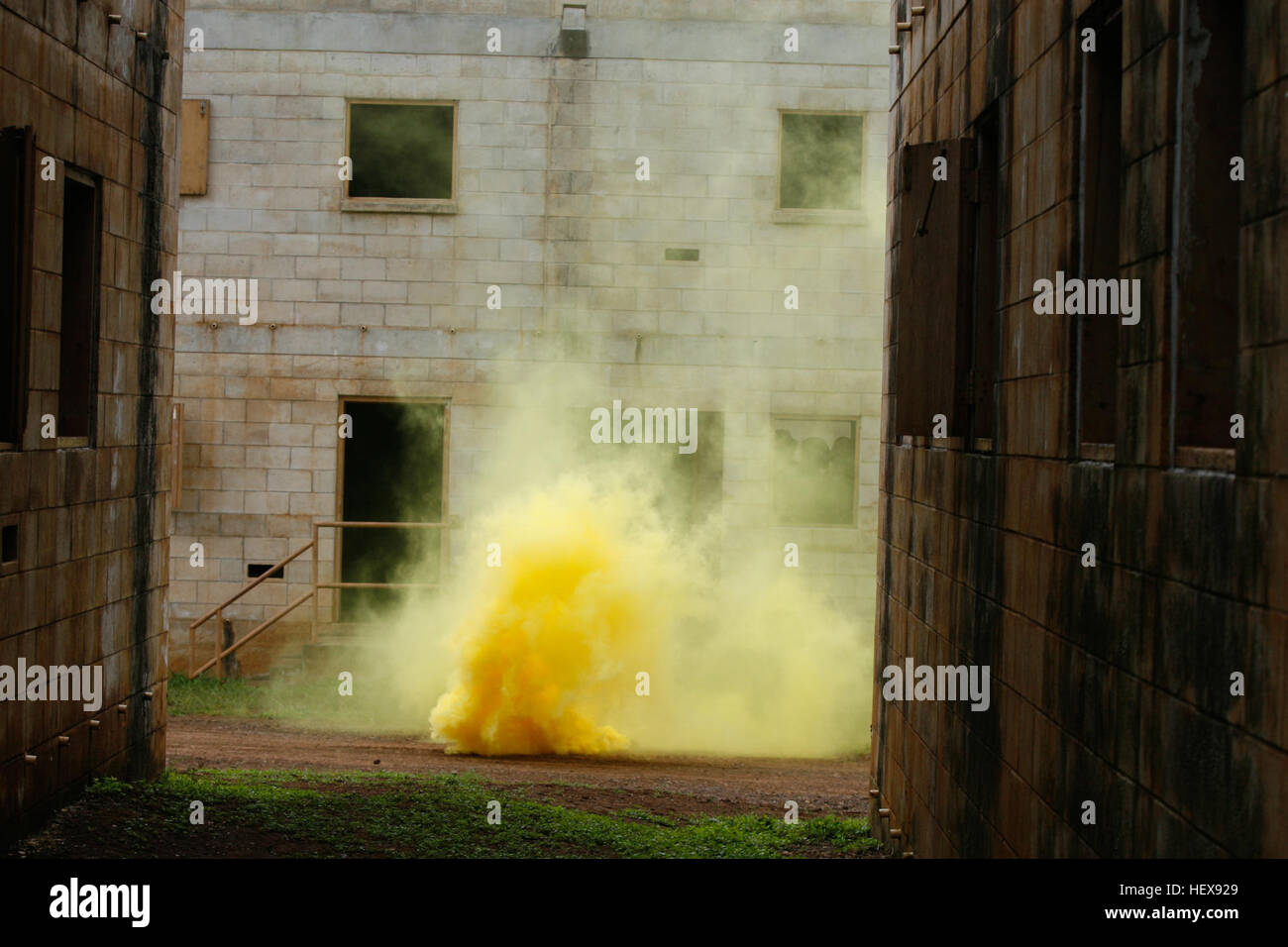 An M18 smoke hand grenade is activated by U.S. Marines from Lima Co ...