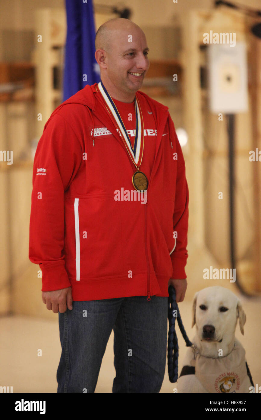 U.S. Marine Staff Sgt. Matthew Benack from Arnold, Mont. receives a ...