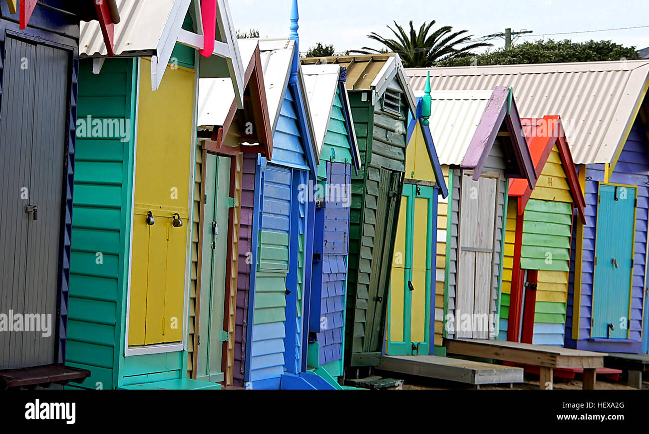 The image captures the vibrant, colorful bathing boxes at Brighton ...