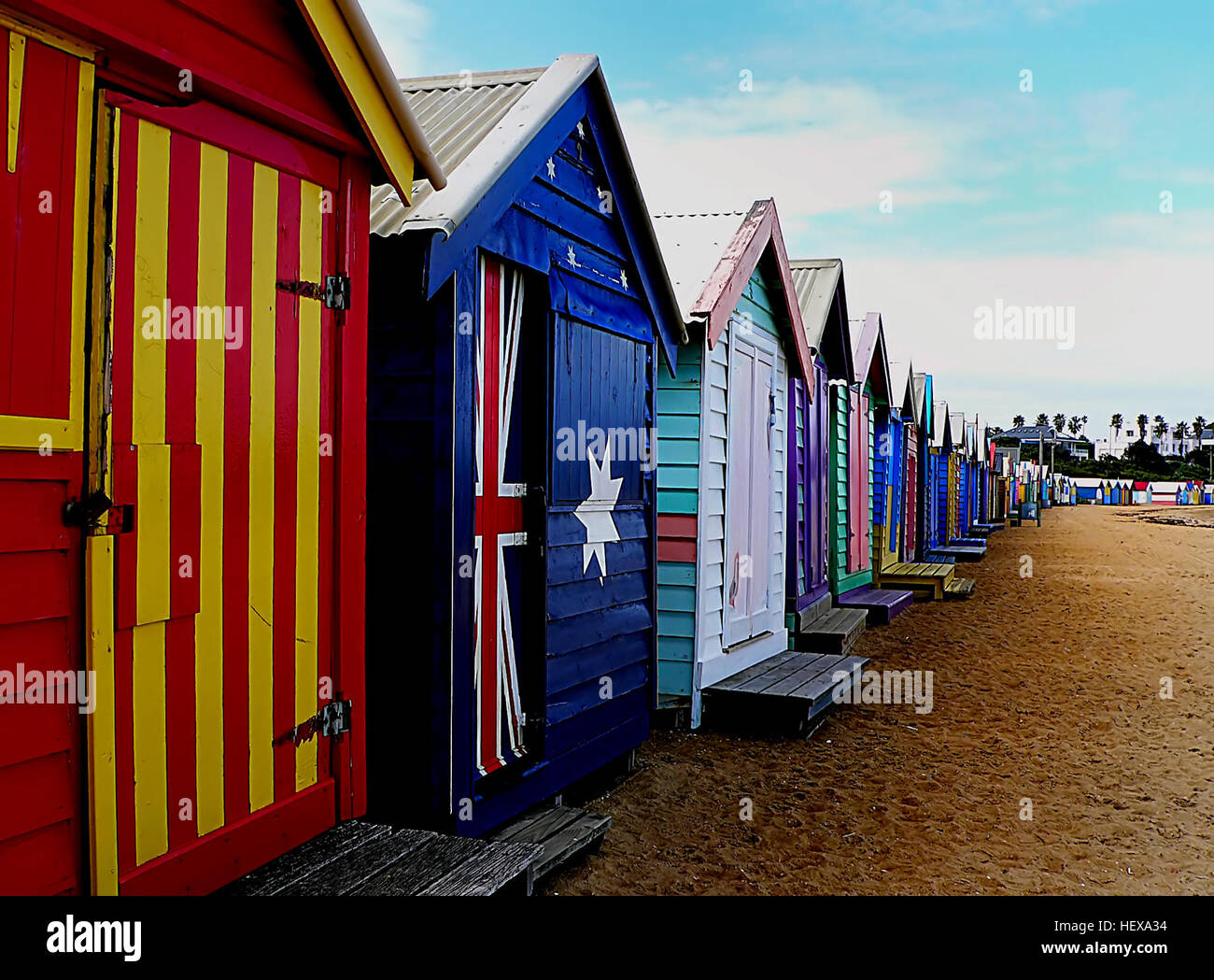This photograph showcases the iconic bathing boxes at Brighton Beach in ...