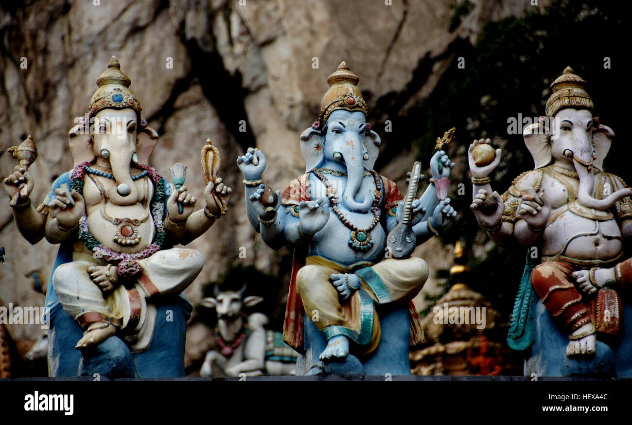 The Batu Caves in Malaysia feature Hindu temple structures within ...