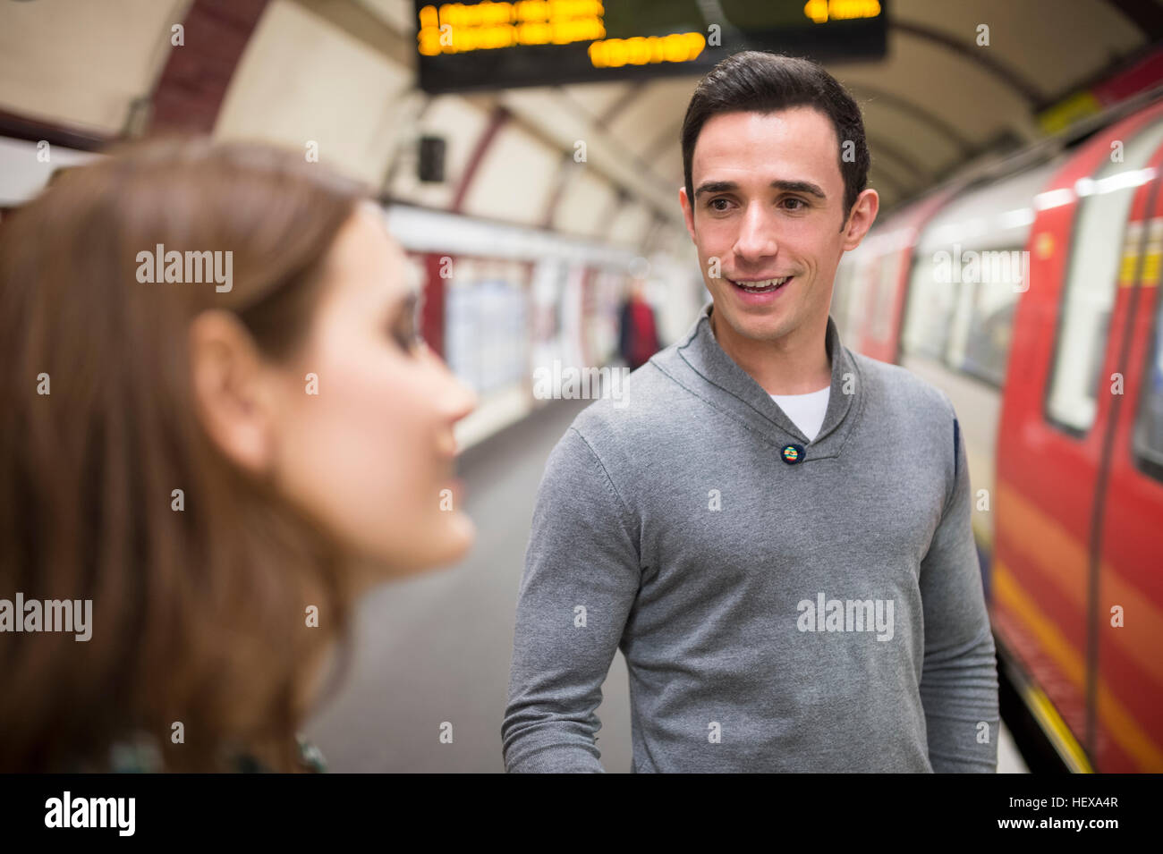 Man woman talking train station hi-res stock photography and images - Alamy