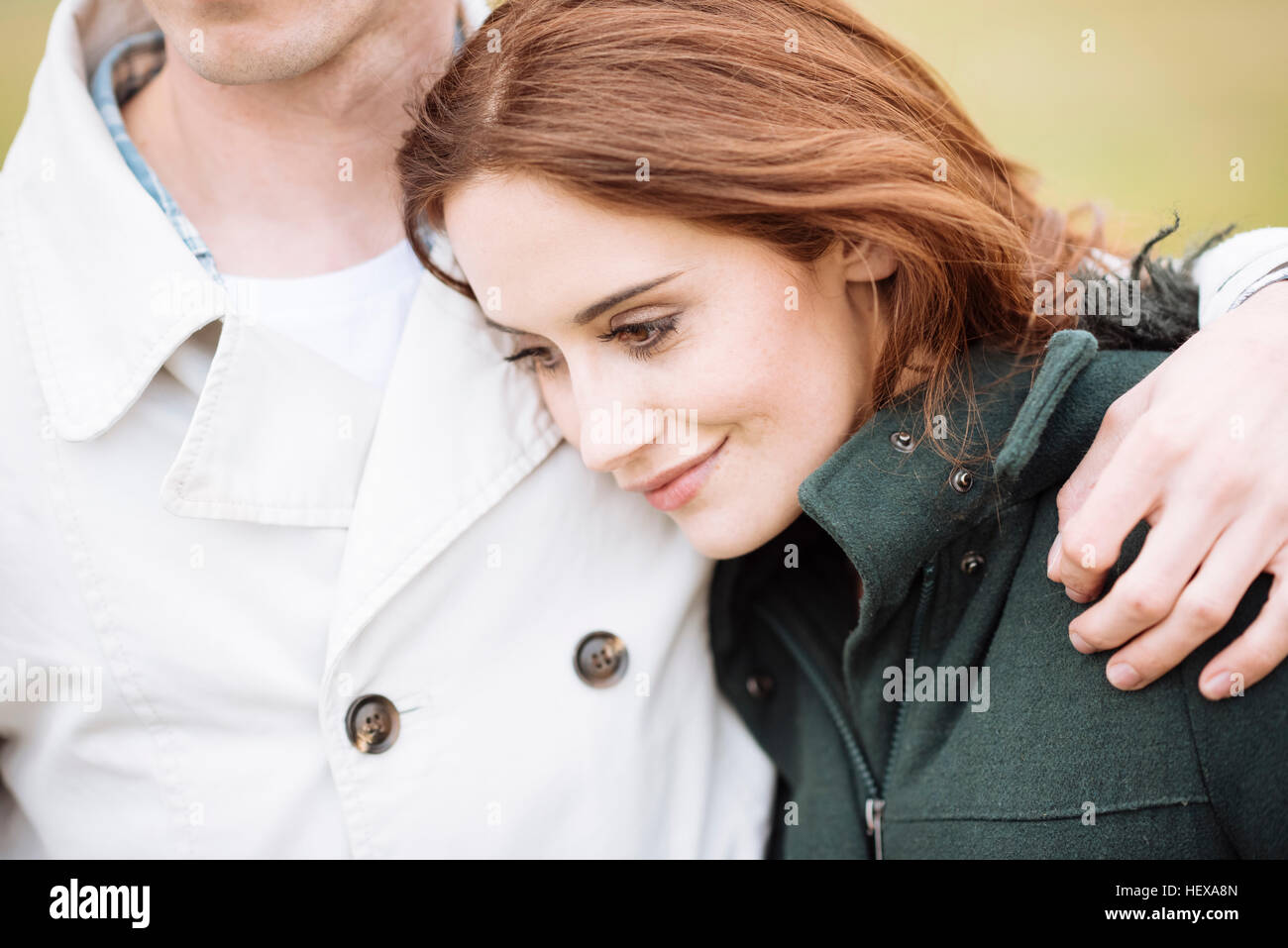 Cropped view of couple hugging and smiling Stock Photo - Alamy