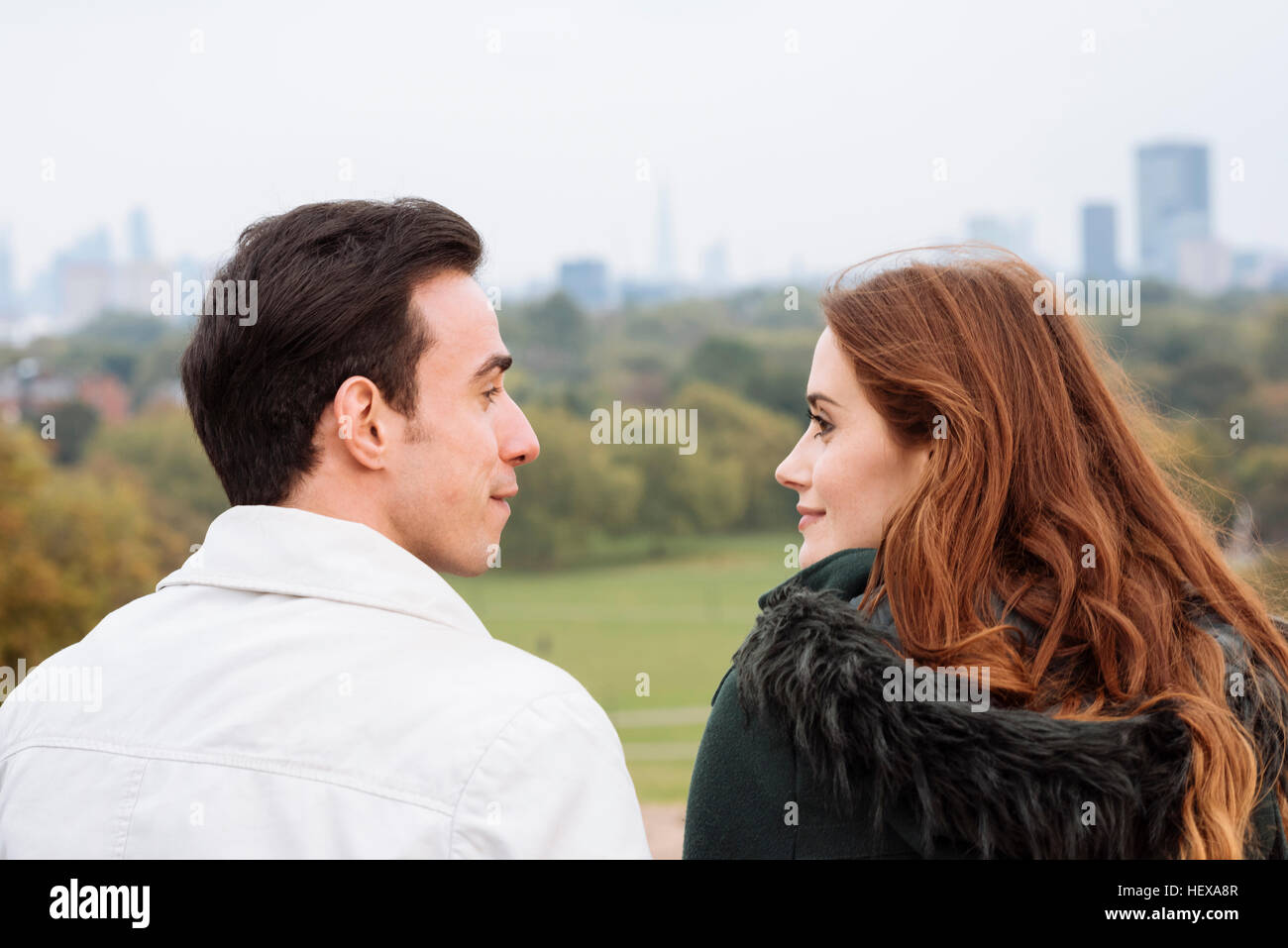 Rear view of couple face to face Stock Photo - Alamy