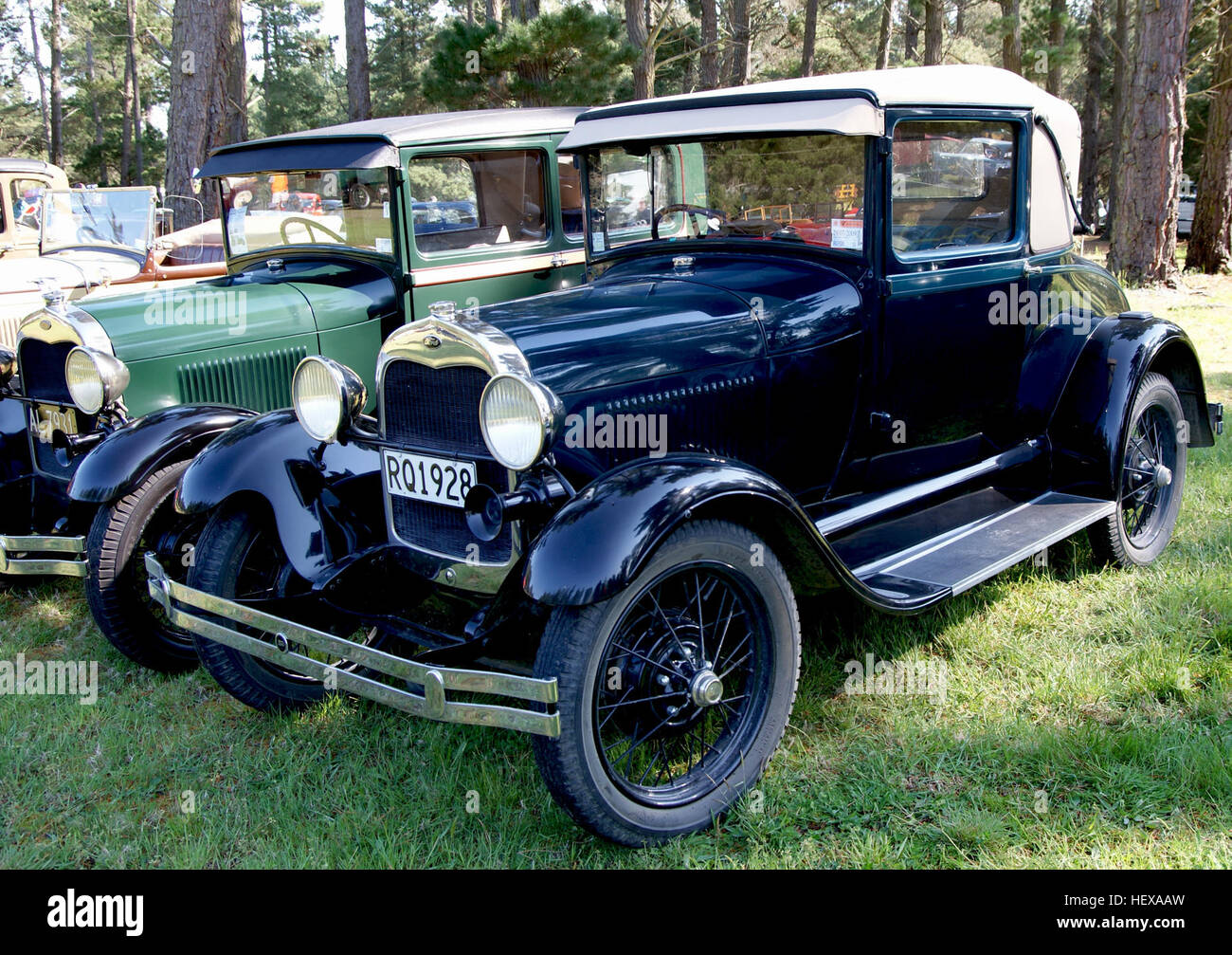 This image showcases the 1928 Ford Coupe, a classic automobile known ...