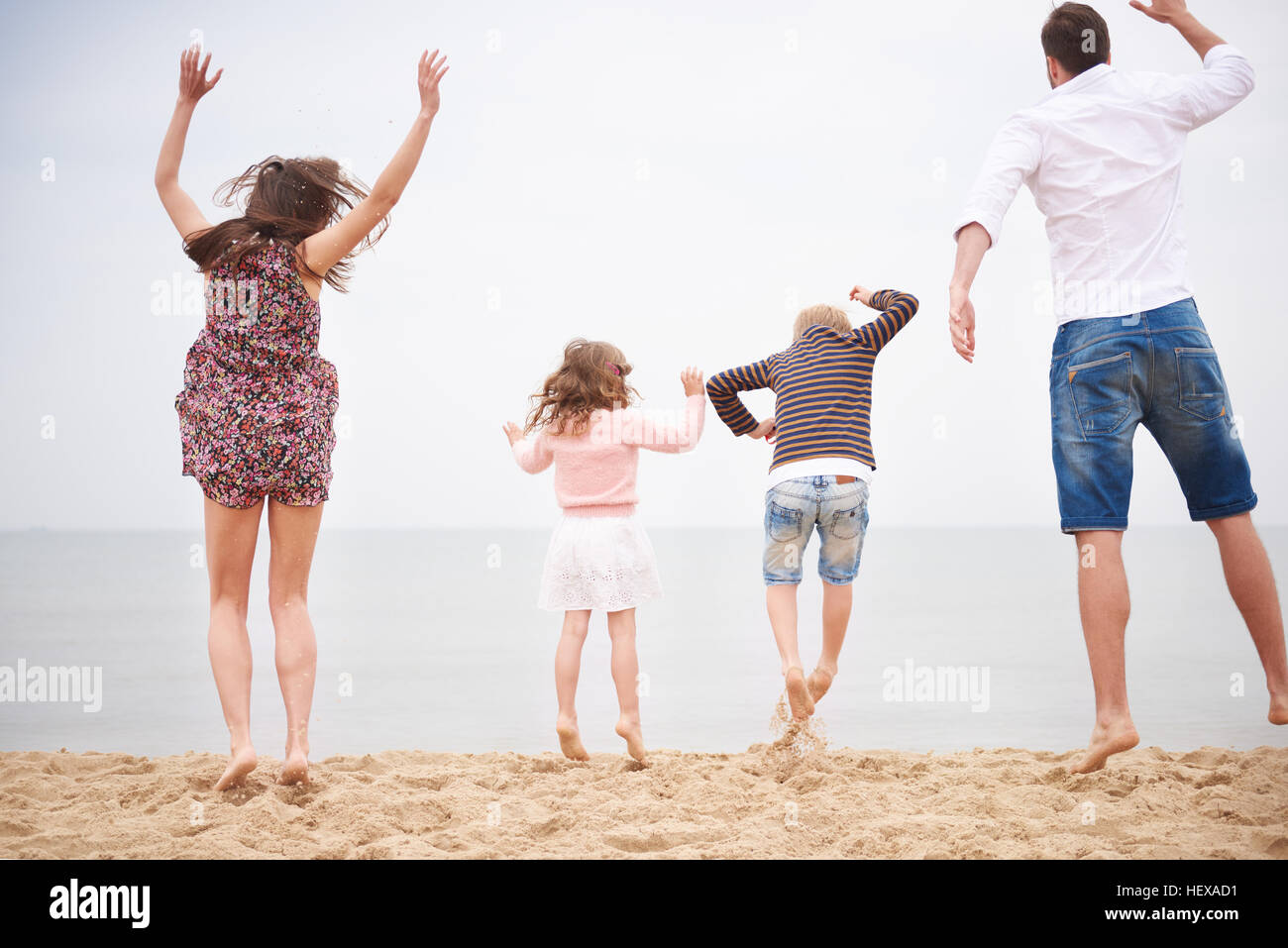 Family jumping hi-res stock photography and images - Alamy