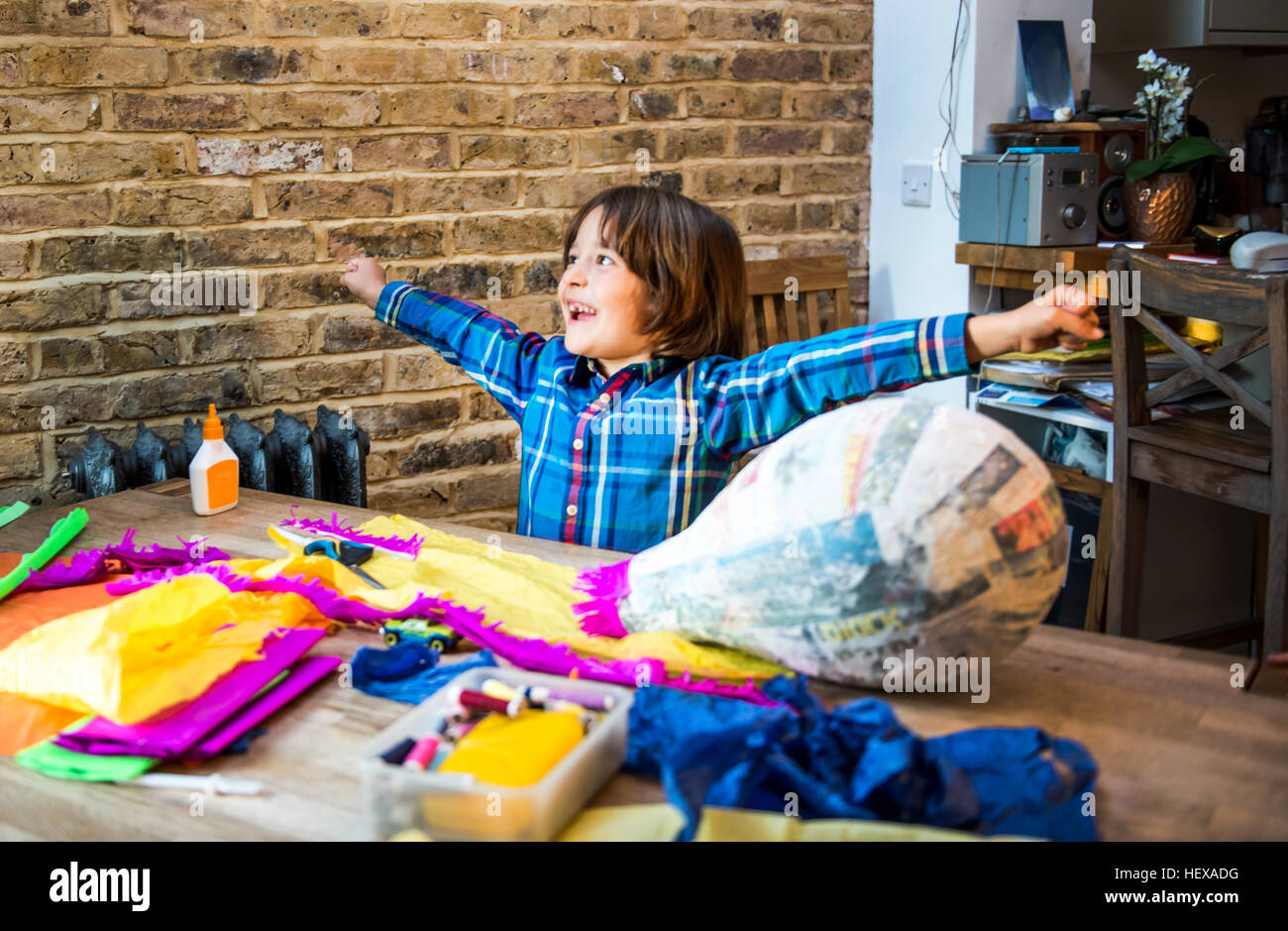 Boy decorating pinata at home Stock Photo - Alamy