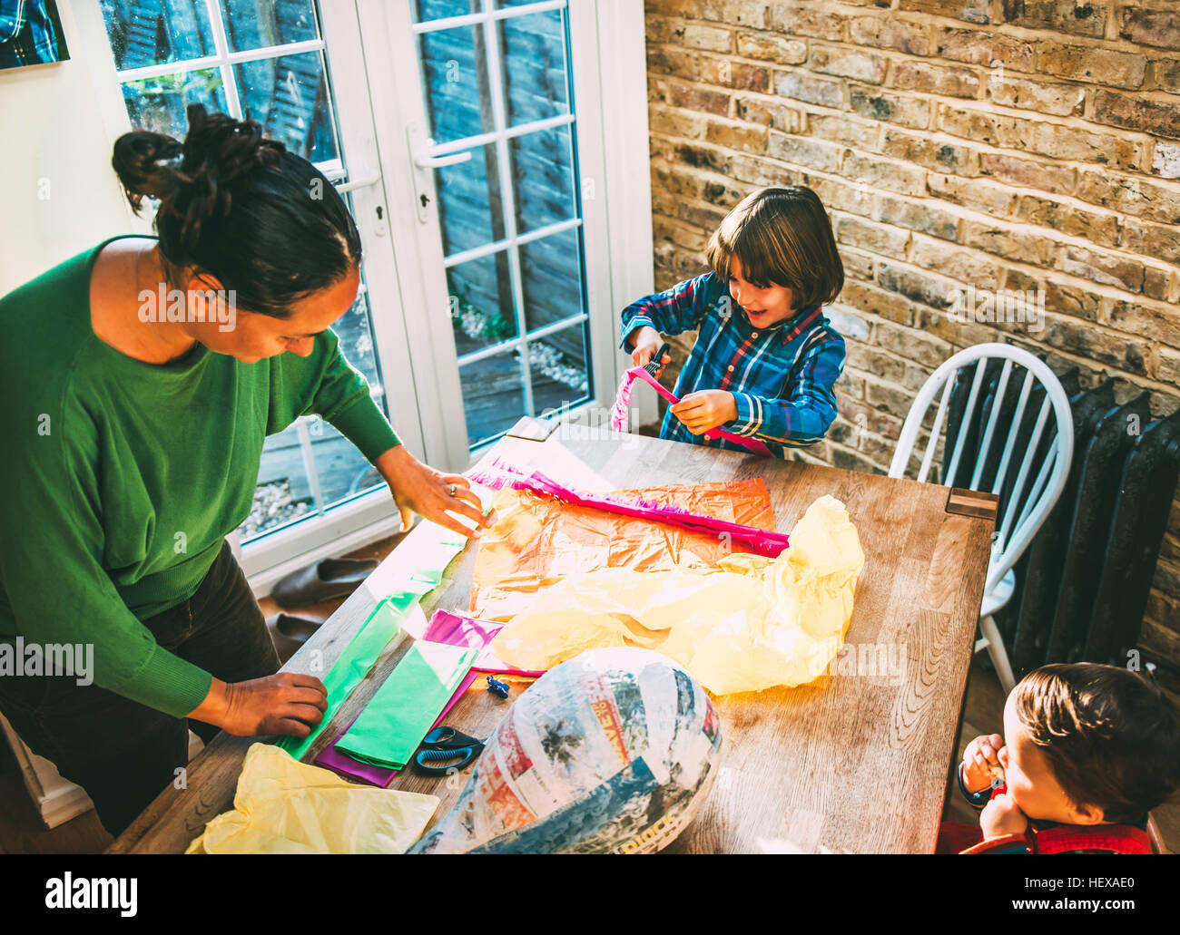 Mother and son decorating pinata at home Stock Photo - Alamy