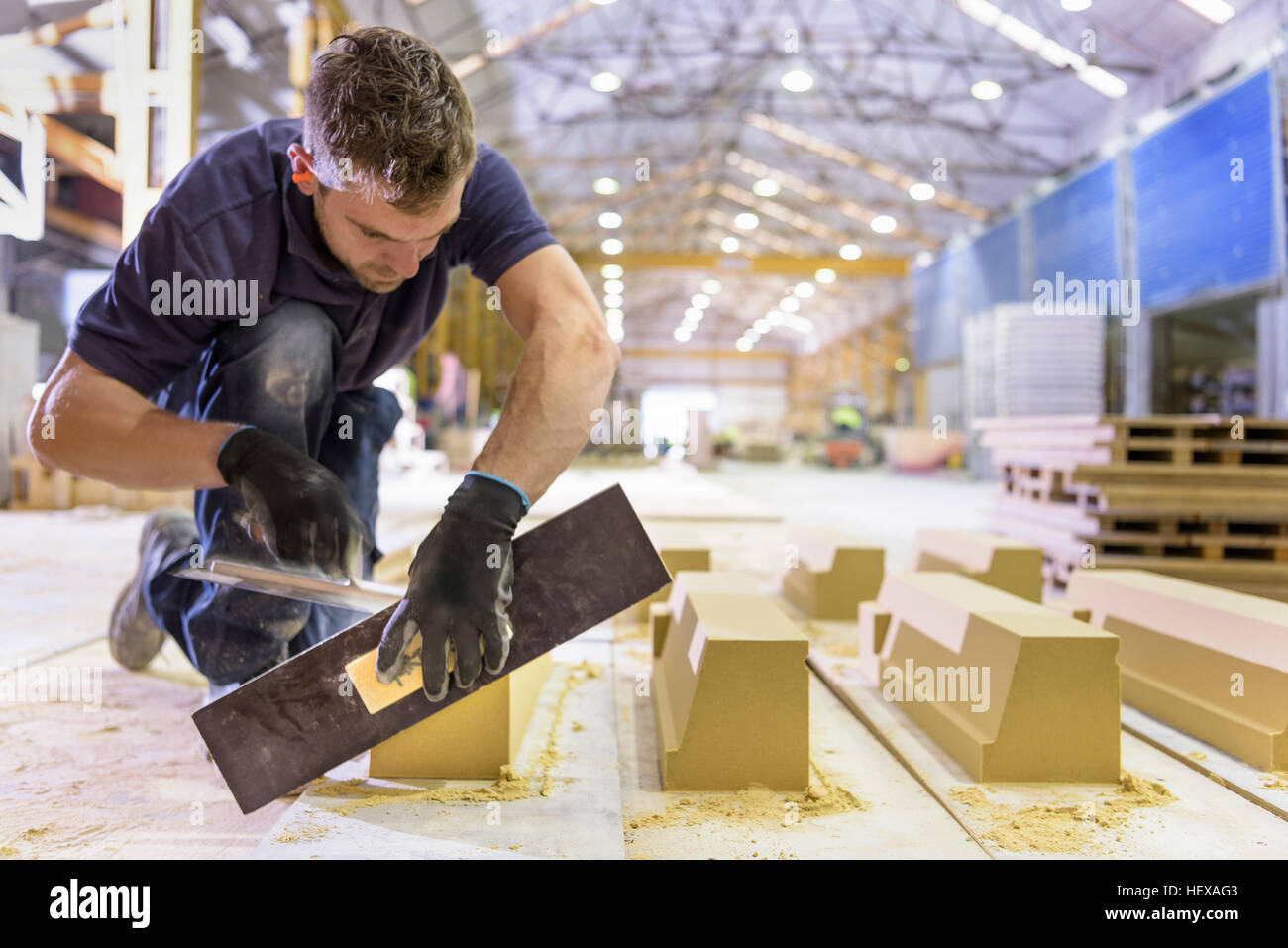 Worker moulding stone in architectural stone factory Stock Photo - Alamy