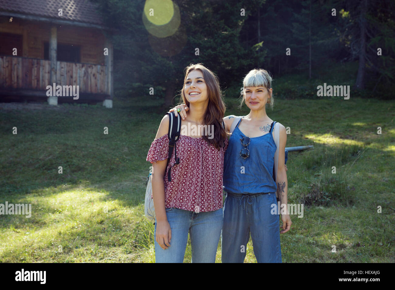 Portrait of two female friends in forest, Sattelbergalm, Tyrol, Austria ...