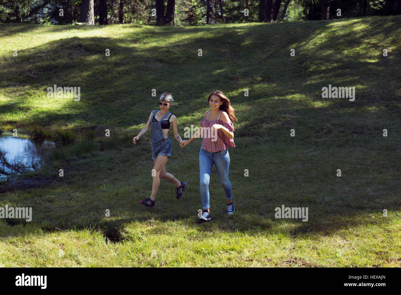 Two best friends holding hands hi-res stock photography and images - Alamy