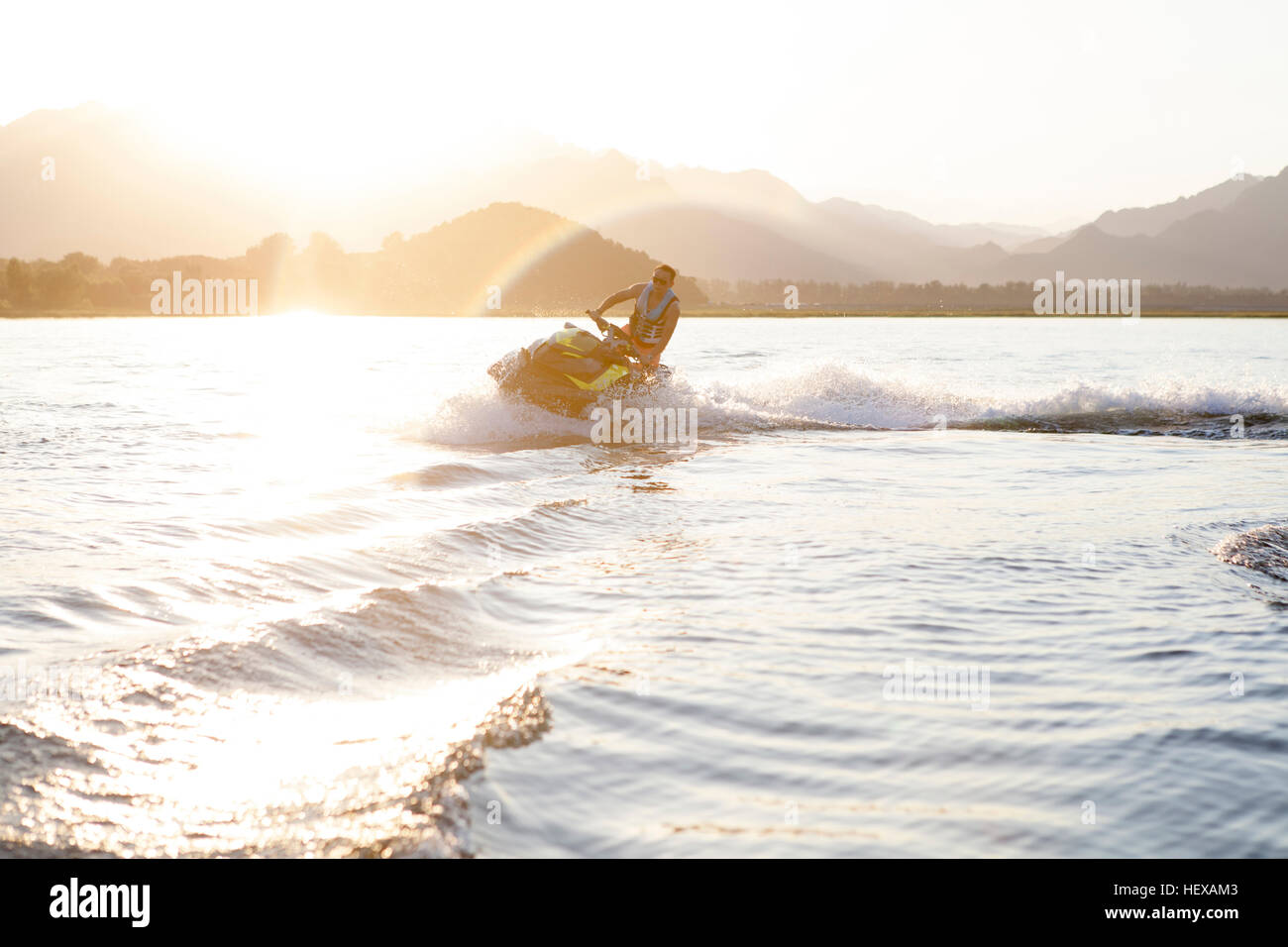 Man riding jet ski on lake, Beijing, China Stock Photo - Alamy