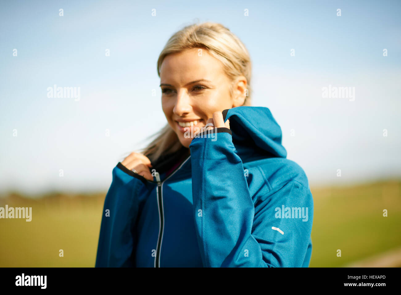 Portrait of woman looking away smiling Stock Photo - Alamy