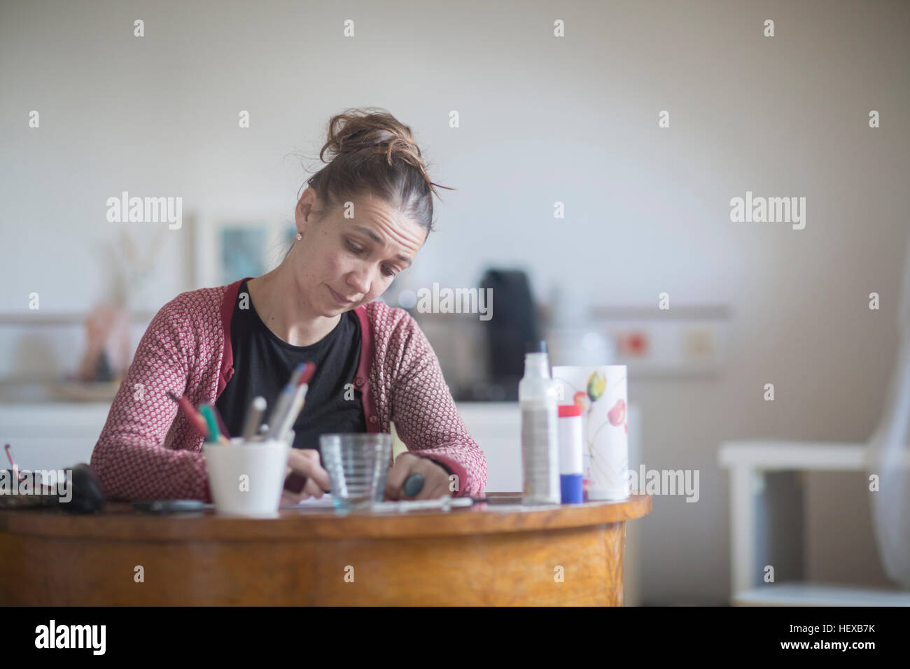 Mature woman writing in hi-res stock photography and images - Alamy