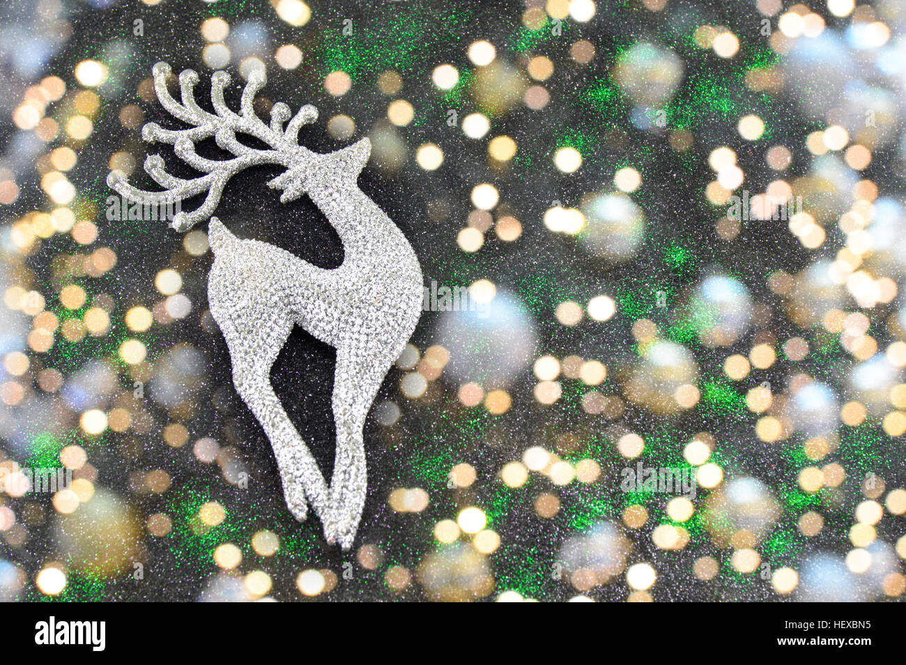 Silver reindeer toy on dark festive background Stock Photo - Alamy